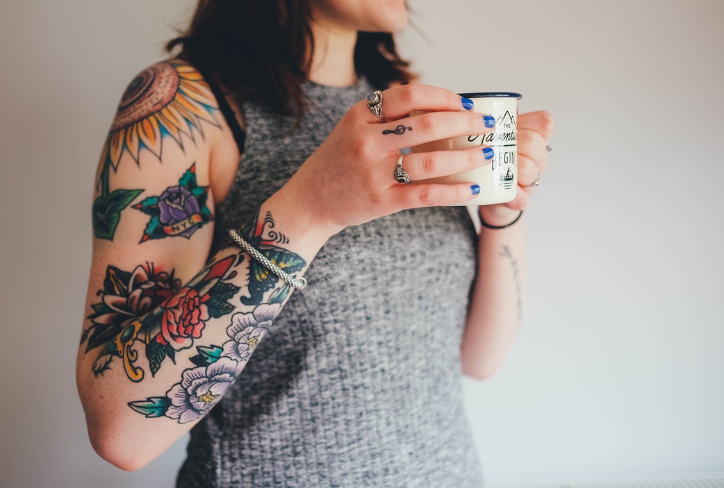 Can skin cancers develop under tattooed skin?